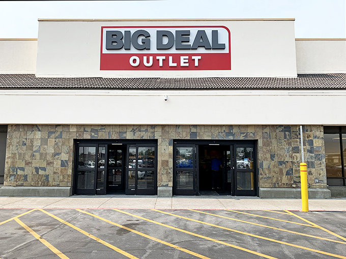 The bold red and black signage of Big Deal Outlet promises exactly what awaits inside—deals so good they'll make your wallet do a happy dance.