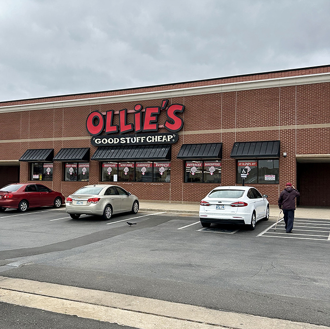 The iconic red Ollie's sign beckons like a retail lighthouse, promising treasure hunters the thrill of "Good Stuff Cheap" under Oklahoma's sky.