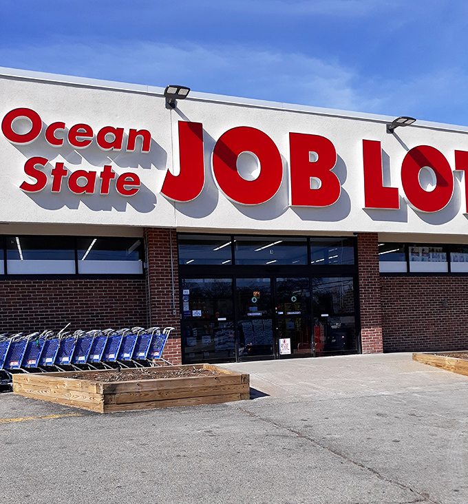 The iconic red and white fa&ccedil;ade of Ocean State Job Lot beckons bargain hunters like a retail lighthouse guiding ships to treasure-filled shores.