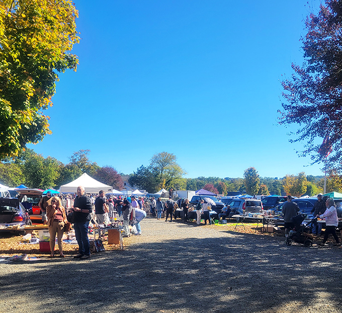 Perfect autumn skies welcome treasure hunters to Elephant's Trunk, where vendors and shoppers mingle in New Milford's scenic countryside.