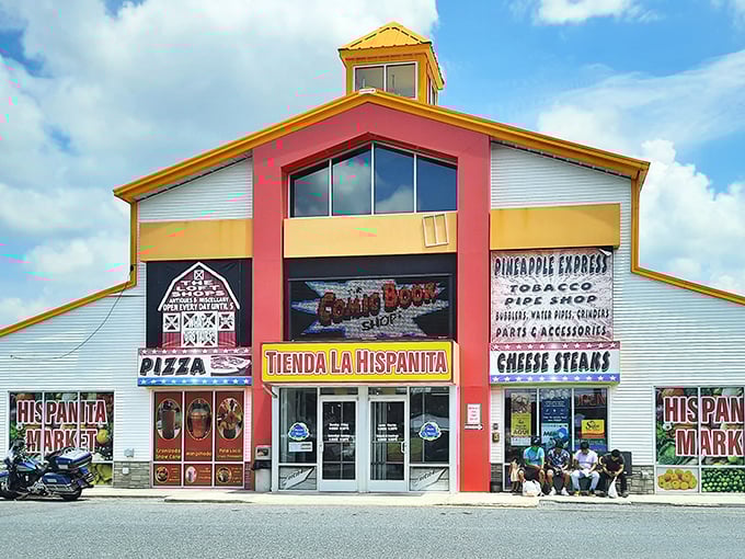 The colorful facade of Laurel Junction beckons like a treasure chest waiting to be opened, promising everything from pizza to pipe shop treasures under one roof.