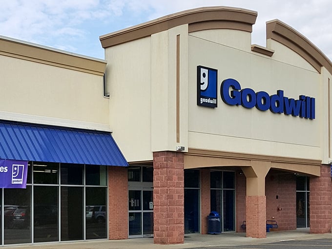 Architectural modesty meets thrifting magnificence. Behind these brick-and-beige walls, your $35 transforms into a shopping adventure worthy of Indiana Jones&mdash;if he hunted vintage sweaters instead of artifacts.