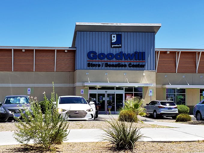 The desert sun gleams off Goodwill's modern facade, where Henderson's savviest shoppers hunt for treasures beneath that iconic blue logo.