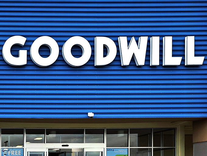 The iconic blue facade of Goodwill on San Mateo Boulevard stands out like a sapphire in the desert, promising treasure hunters their next great find.