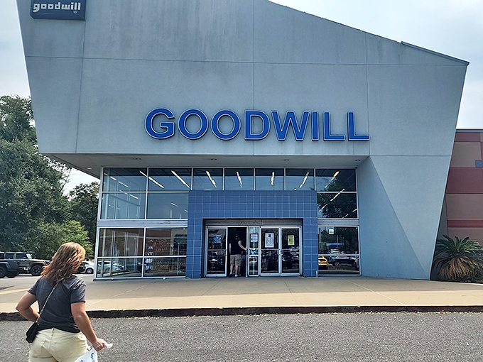 The sleek, modern facade of Pineville's Goodwill beckons bargain hunters with its distinctive blue signage and contemporary design.