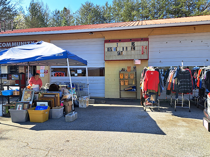 The outdoor treasure hunt begins! Colorful clothing racks and plastic tubs of curiosities await under the bright blue canopy&mdash;thrifting al fresco at its finest.