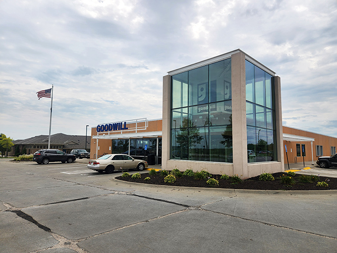 With its gleaming glass corner and welcoming entrance, this Goodwill location breaks the thrift store stereotype faster than vinyl records disappear from its shelves on delivery day.