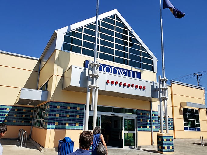 The distinctive triangular entrance of Milwaukie's Goodwill beckons bargain hunters like a retail lighthouse guiding ships to treasure-filled shores.