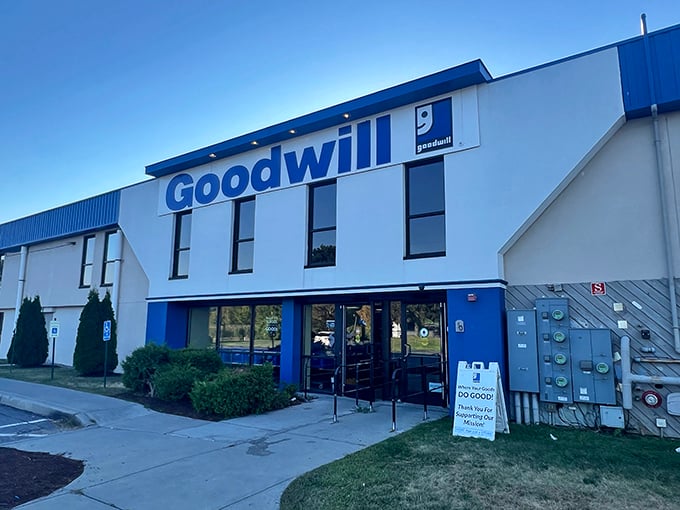 The iconic blue-and-white facade of Williston's Goodwill beckons bargain hunters like a retail lighthouse guiding ships to treasure-filled shores.
