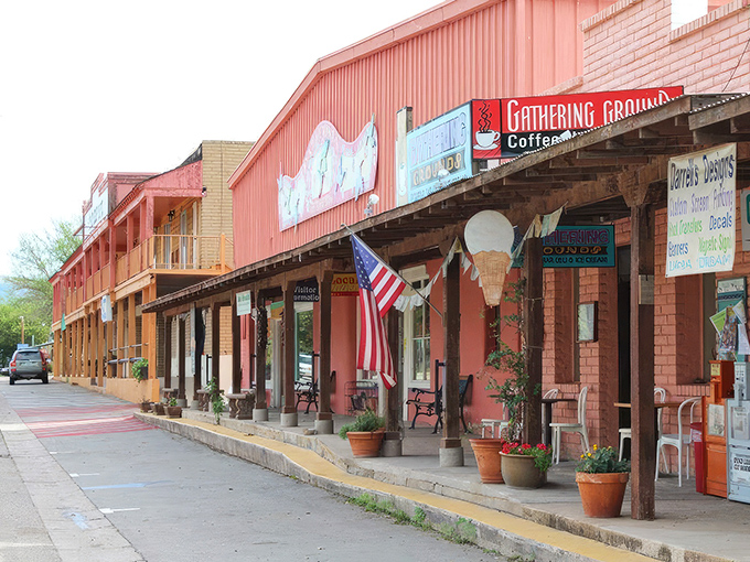 The Gathering Grounds coffee shop anchors Patagonia's vibrant main street, where colorful storefronts and potted plants welcome visitors to linger.