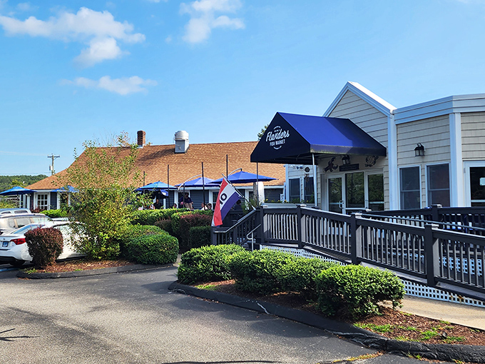 The classic New England charm of Flanders Fish Market beckons seafood lovers with its navy awning and welcoming entrance&mdash;coastal dining at its unpretentious best.