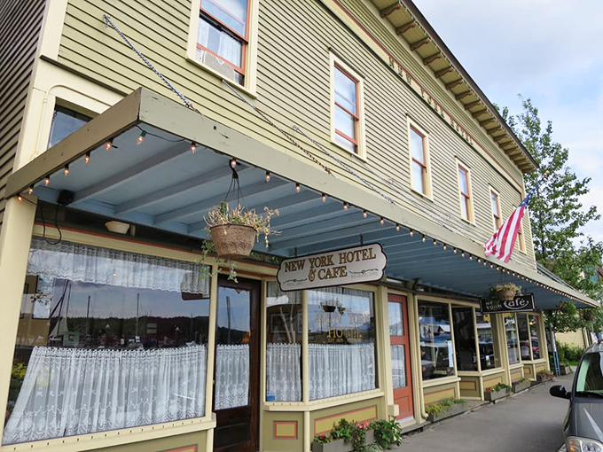 The historic New York Hotel & Cafe stands proudly in downtown Ketchikan, its weathered charm and string lights beckoning hungry travelers like a lighthouse for the famished.