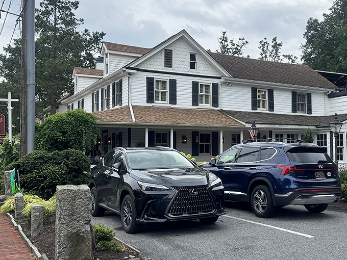 The classic American tavern exterior promises warmth, good company, and meals worth the drive through Centreville's scenic roads.