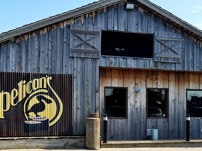 The golden Pelican's logo against weathered wood siding is Oklahoma's equivalent of a treasure map X &ndash; marking the spot where prime rib dreams come true.