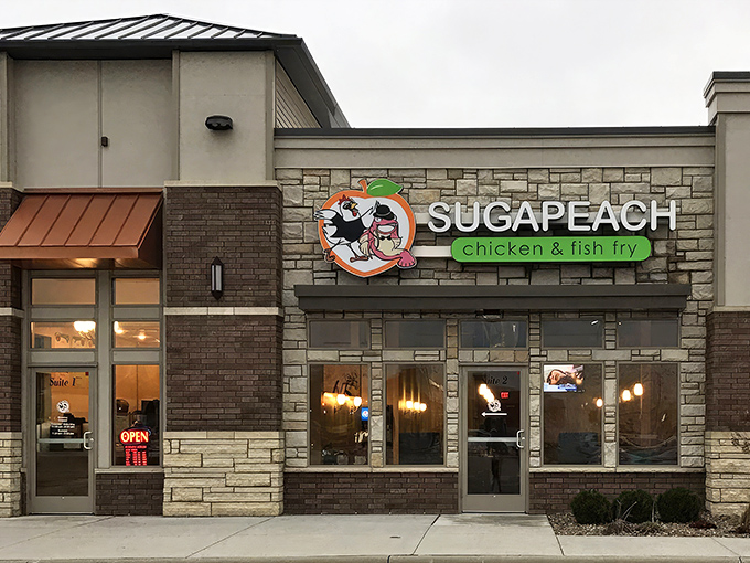 Sugapeach's unassuming exterior hides culinary treasures within, like finding a diamond in a strip mall. The bright logo promises Southern comfort in the heart of Iowa.