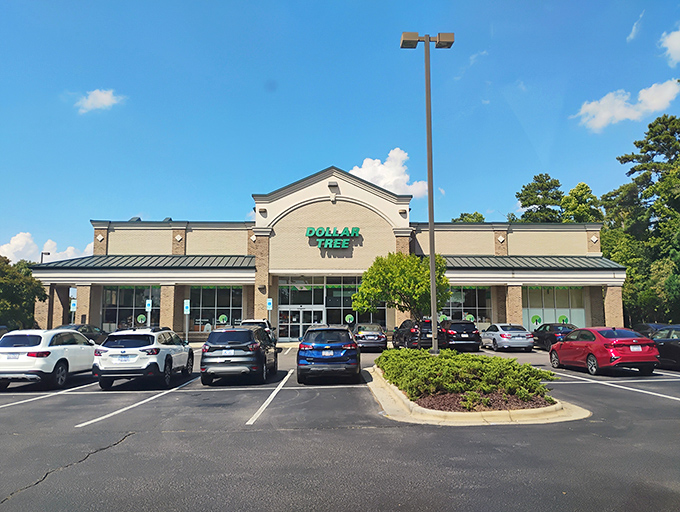The gleaming green Dollar Tree sign beckons like a budget-friendly lighthouse, guiding thrifty shoppers to safe harbor in Cary's retail landscape.