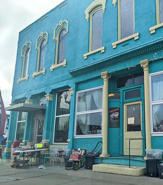 The turquoise facade of Awesome Possum Flea Market stands out in Hamburg like a peacock at a pigeon convention, promising treasures within its historic walls.