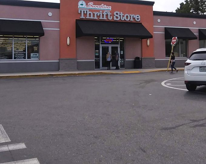 The coral-colored exterior of Sunshine Thrift beckons like a siren song to bargain hunters. Florida's answer to retail therapy without the therapy bills.