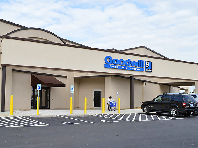 The unassuming exterior of Goodwill Lawrence beckons with its iconic blue sign&mdash;a portal to treasure hunting adventures that won't break the bank.