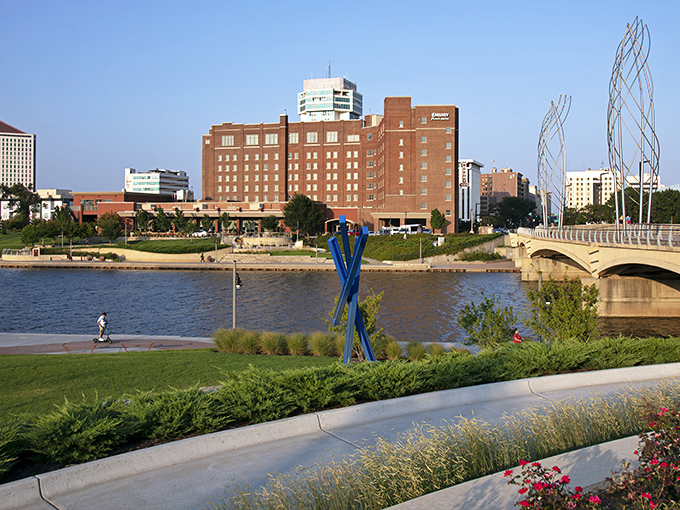 Wichita's riverfront skyline shimmers like an oasis in the prairie, where historic brick buildings and modern architecture create a postcard-perfect urban landscape.