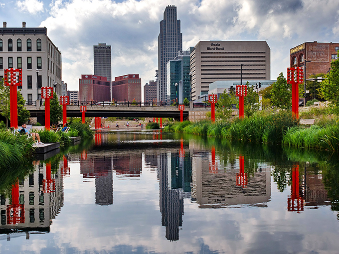 Omaha's riverfront reflection creates a perfect mirror image of the city skyline, proving that Nebraska knows how to double the visual impact without charging extra.