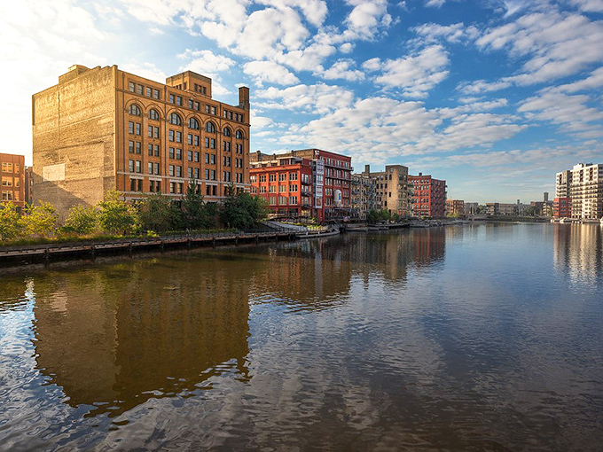 Milwaukee's historic riverfront buildings reflect in the water like a postcard come to life, offering a peaceful urban oasis in the heart of the city.