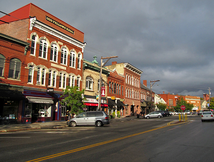 Downtown Exeter's historic brick buildings stand like old friends who've weathered centuries together, sharing stories beneath stormy skies.