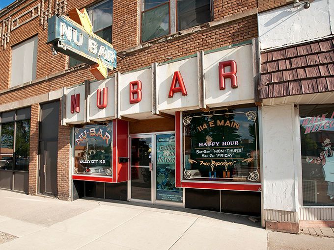 The iconic NuBar sign glows like a beacon of hospitality on Valley City's Main Street, where small-town charm meets classic watering hole ambiance.