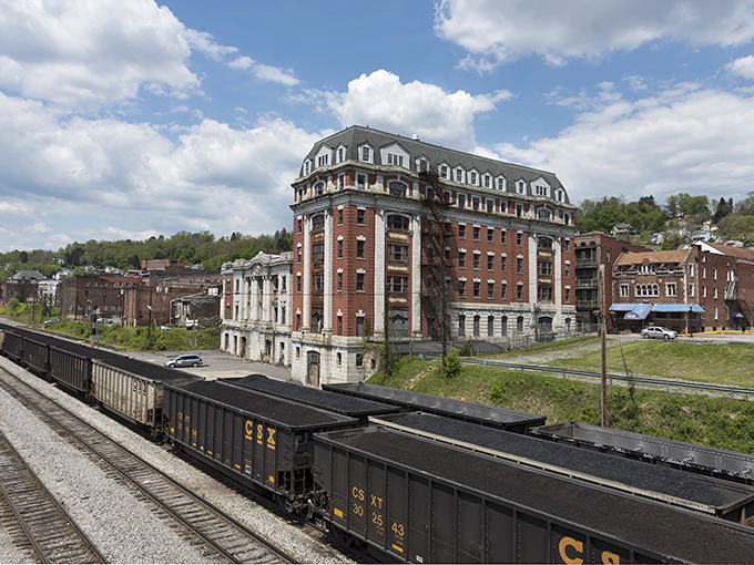Grafton's historic B&O Railroad Hotel stands as a magnificent brick testament to the town's railway heritage, with passing coal trains still rumbling by as they have for generations.