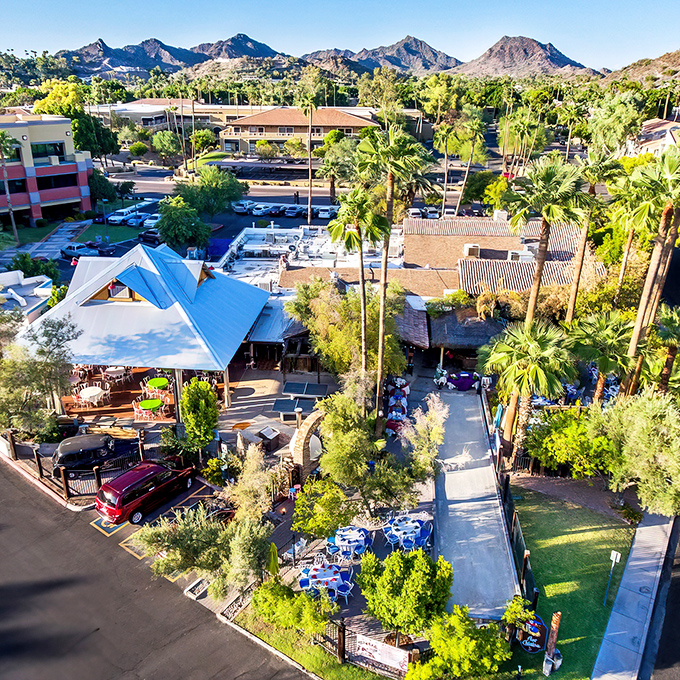 Paradise found: Aunt Chilada's nestles against Phoenix's iconic mountains like a culinary oasis, palm trees standing guard over this desert treasure.