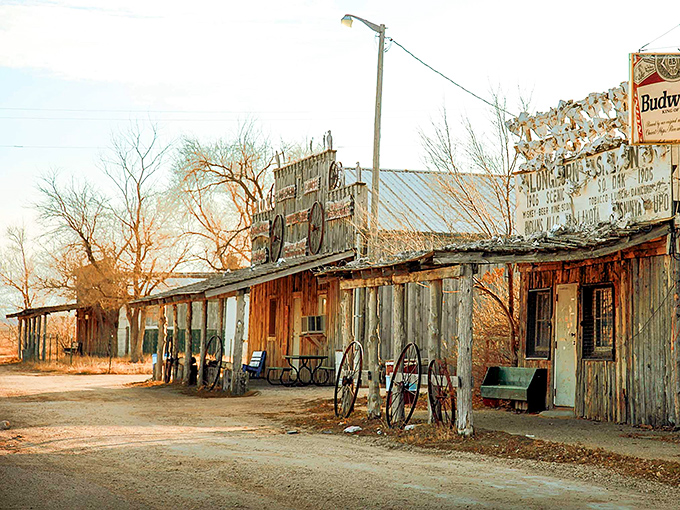 Time stands still in Scenic, South Dakota, where weathered wooden storefronts bask in golden hour light like actors waiting for their cue in a forgotten Western.