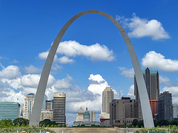 The Gateway Arch curves gracefully against a perfect blue sky, a 630-foot smile welcoming visitors to a city that delivers big experiences without the big-city stress.
