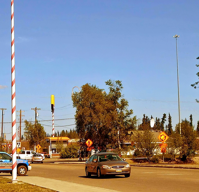 Summer in North Pole brings blue skies and candy-striped lamp posts&mdash;proof that Christmas cheer doesn't melt, even when the snow does.