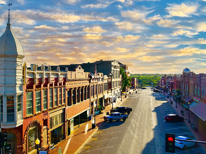 Sunset paints Guthrie's historic downtown in golden light, transforming brick facades into a scene worthy of a Hollywood period film.