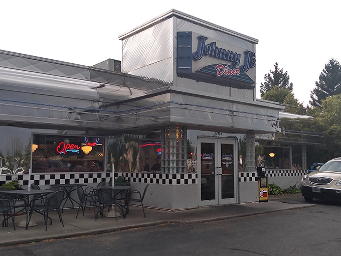 The neon "Open" sign glows like a warm invitation, while outdoor seating awaits those perfect Wyoming summer evenings.