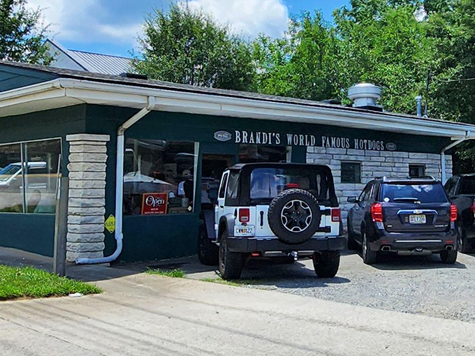 That unassuming white building with the metal roof is your gateway to hot dog heaven and reasonable prices.