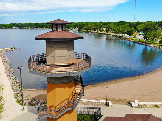 The iconic lighthouse observation tower stands sentinel over Storm Lake's shoreline, offering panoramic views that'll make your Instagram followers green with envy.