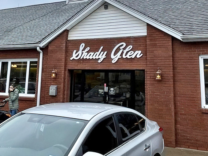 The brick facade of Shady Glen welcomes you like an old friend who's been waiting patiently while you navigated Connecticut's winding roads.