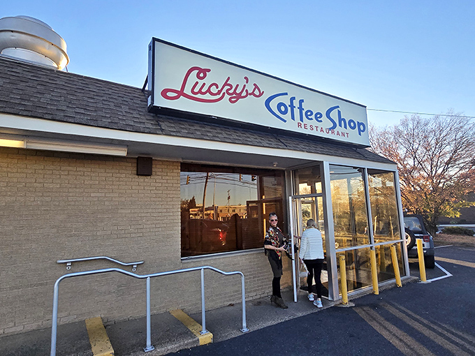 The iconic red and blue sign welcomes hungry patrons like a beacon of hope in a world of overpriced brunches.