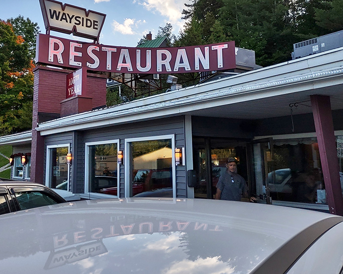 Sunset casts a golden glow on the Wayside's vintage sign, promising the kind of honest meal that makes you forget about your diet resolutions.