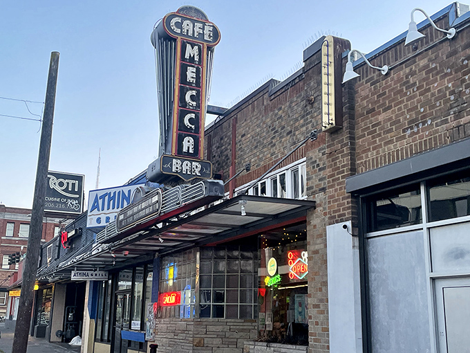 The iconic neon sign of Mecca Cafe stands as a beacon of hope for hungry Seattleites seeking refuge from trendy overpriced eateries.