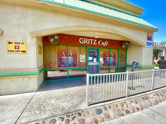 Red and green accents frame the entrance like a year-round holiday invitation to indulge in comfort food that hugs your soul.