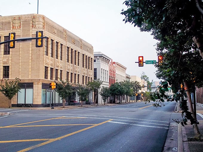 Downtown Hattiesburg at dawn captures that perfect moment when the city is just waking up, historic architecture bathed in soft morning light, promising a day of affordable adventures.