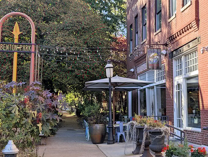 The charming Benton Park entrance welcomes seafood pilgrims with string lights and brick-lined promise. A coastal oasis hiding in plain sight.