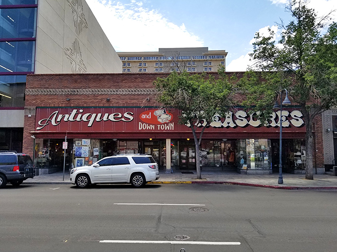 The brick fa&ccedil;ade of Antiques & Treasures ROCK! stands like a time portal on Victorian Avenue, promising adventures through decades past for curious Nevada treasure hunters.