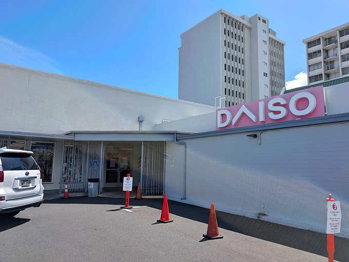 The Honolulu Daiso welcomes shoppers with its iconic pink signage, a beacon of budget-friendly retail therapy.