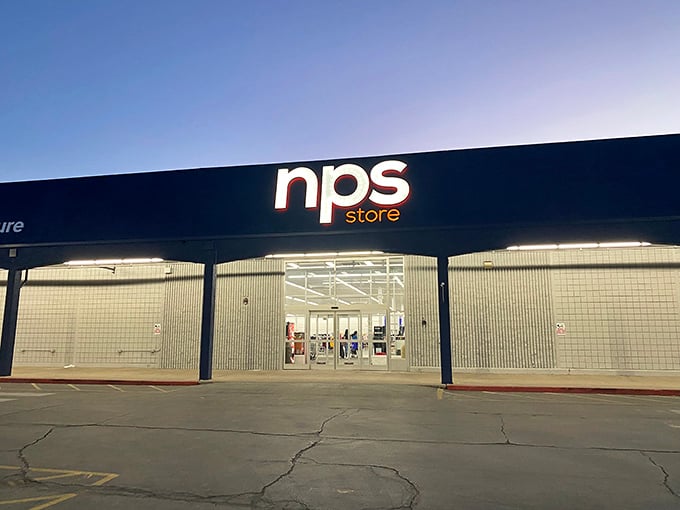 As evening approaches, the NPS sign glows like a beacon for night owls seeking last-minute deals before tomorrow's breakfast.