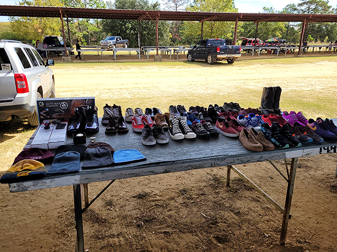 Footwear finds their temporary home on this table of possibilities. From barely-worn sneakers to boots with stories to tell, someone's discarded shoes become another's perfect fit.