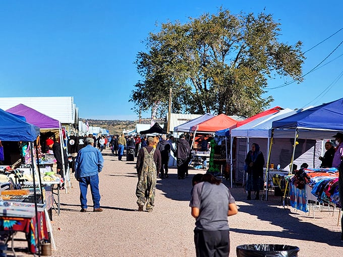 Colorful canopy tents stretch toward the horizon like a bazaar dropped straight into the high desert landscape.