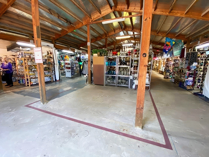 Wooden beams and concrete floors create the perfect backdrop for treasure hunting, where vendor stalls beckon with the promise of undiscovered gems and forgotten memories.